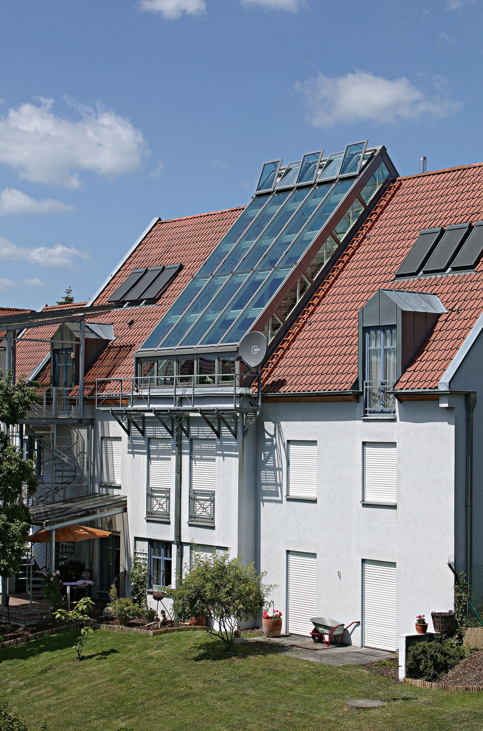 Sanierung und Erweiterung eines Lofts um einen Wintergarten in 12m Höhe ...