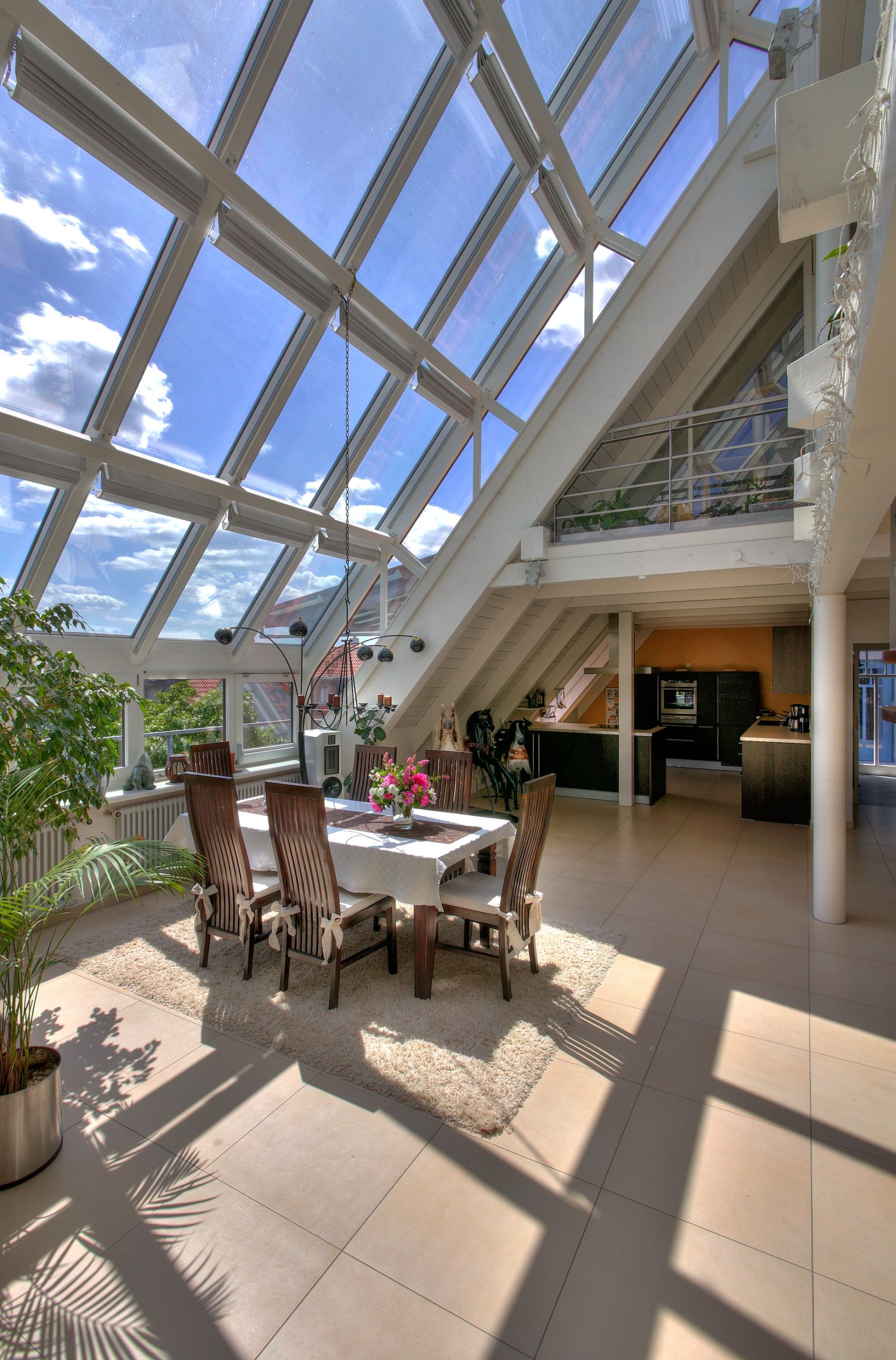 Sanierung und Erweiterung eines Lofts um einen Wintergarten in 12m Höhe ...